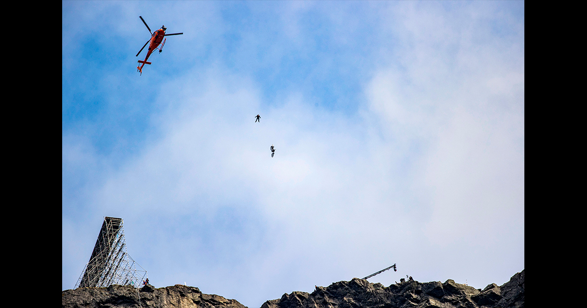 Video: Watch Tom Cruise Ride a Motorcycle Off a Cliff - InsideHook